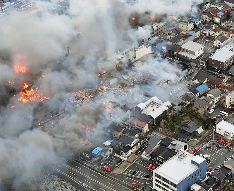 At least 140 buildings on fire in wind-swept blaze in Japan ...